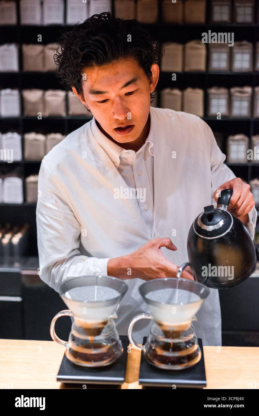TOKYO, JAPAN- OCTOBER 27, 2024: Verical picture of japanese barista ...