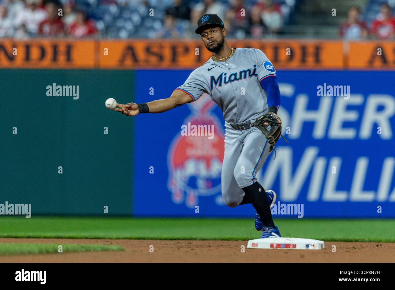 Miami Marlins second baseman Otto Lopez is late on the throw to first ...