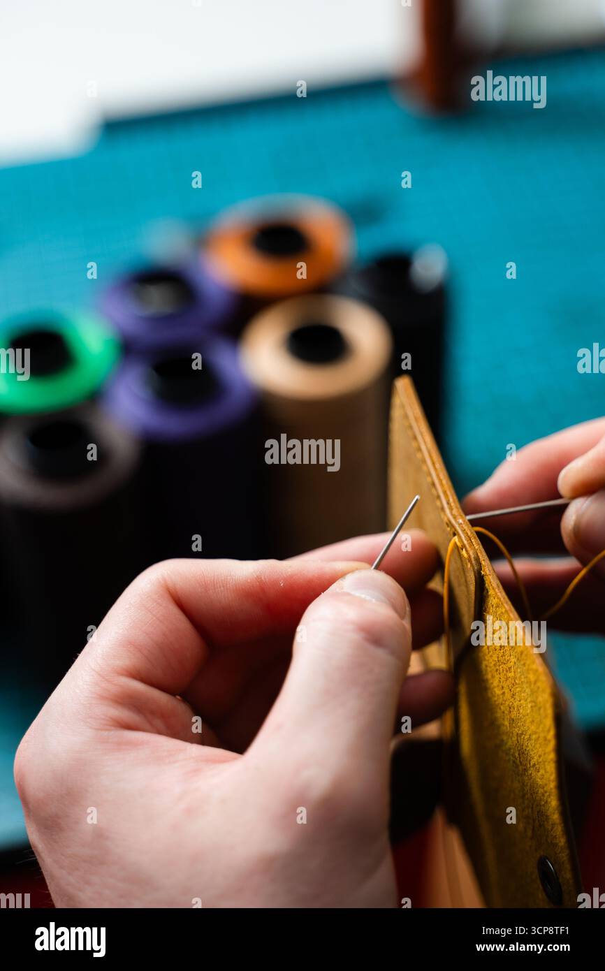 Leather artisans use needles and waxed thread to craft strong seams ...