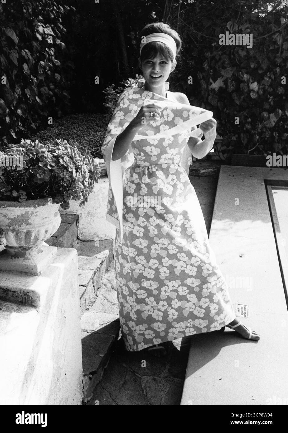 Circa 1975: Italian actress CLAUDIA CARDINALE wearing a floral dress ...