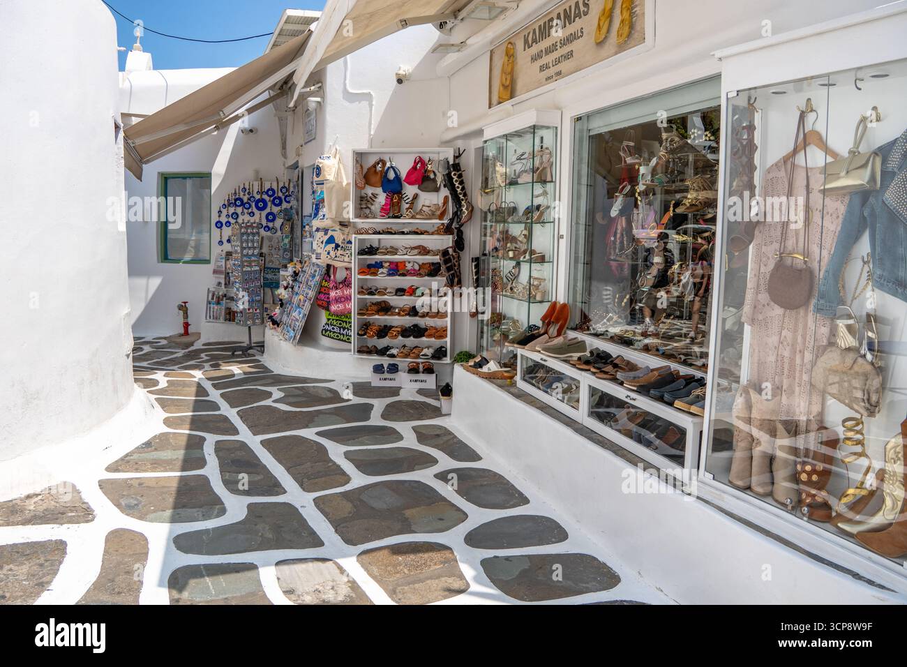 Scenic painted stone walkways and shops in Mykonos, Greece Stock Photo ...