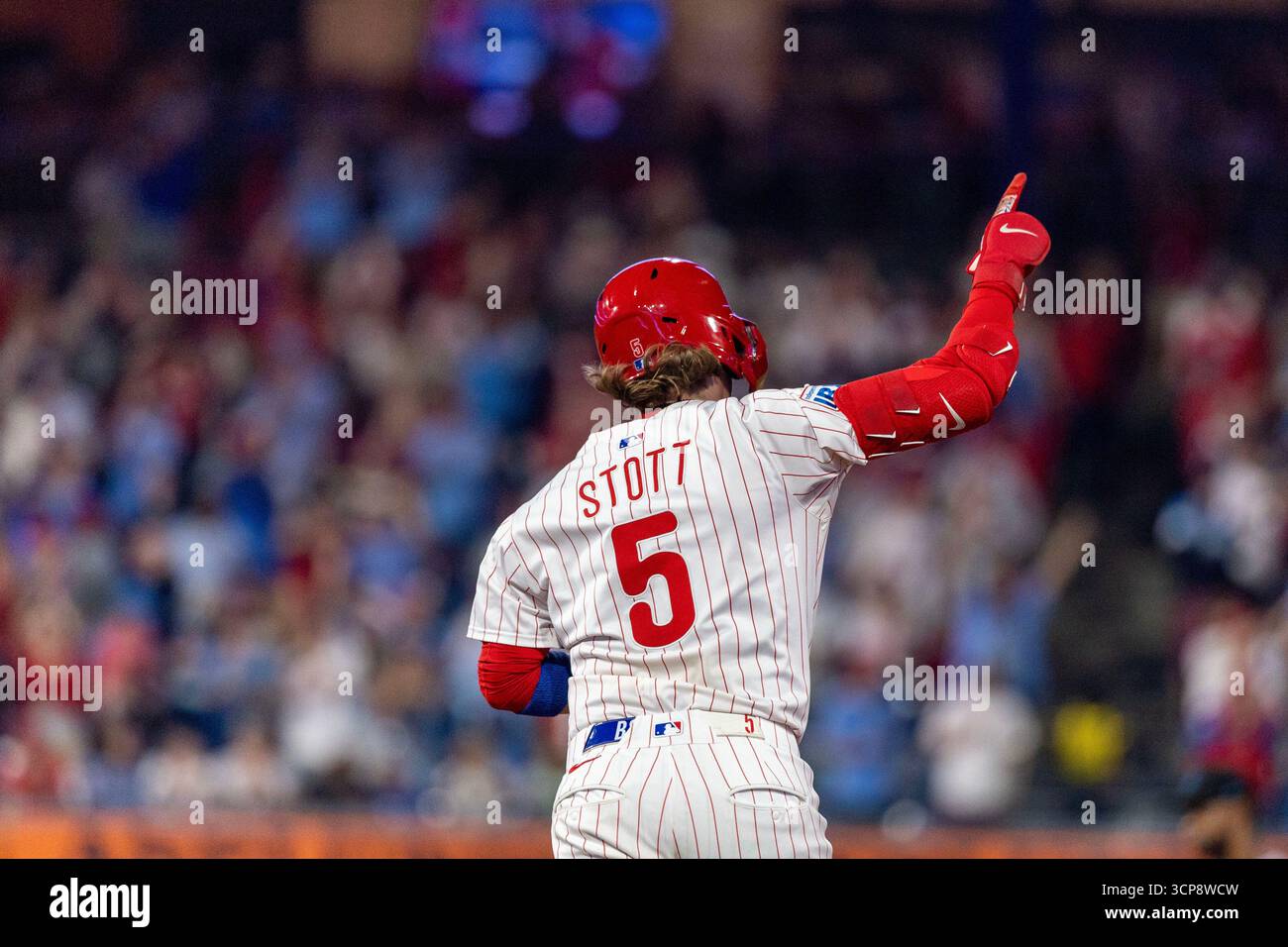 Philadelphia Phillies' Bryson Stott gestures as he feeds the bases ...