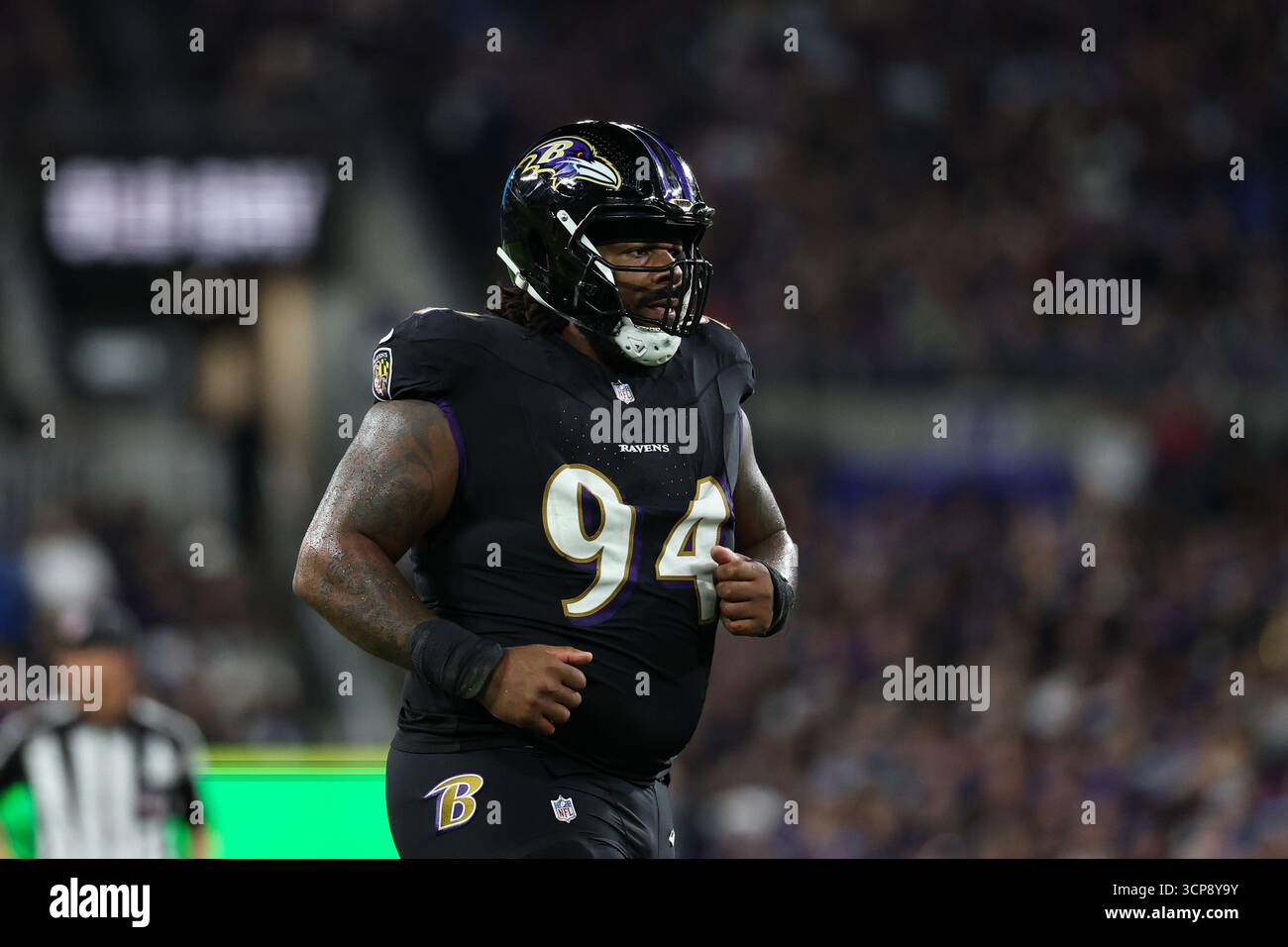 Baltimore Ravens defensive tackle John Jenkins (94) jogs onto the field ...