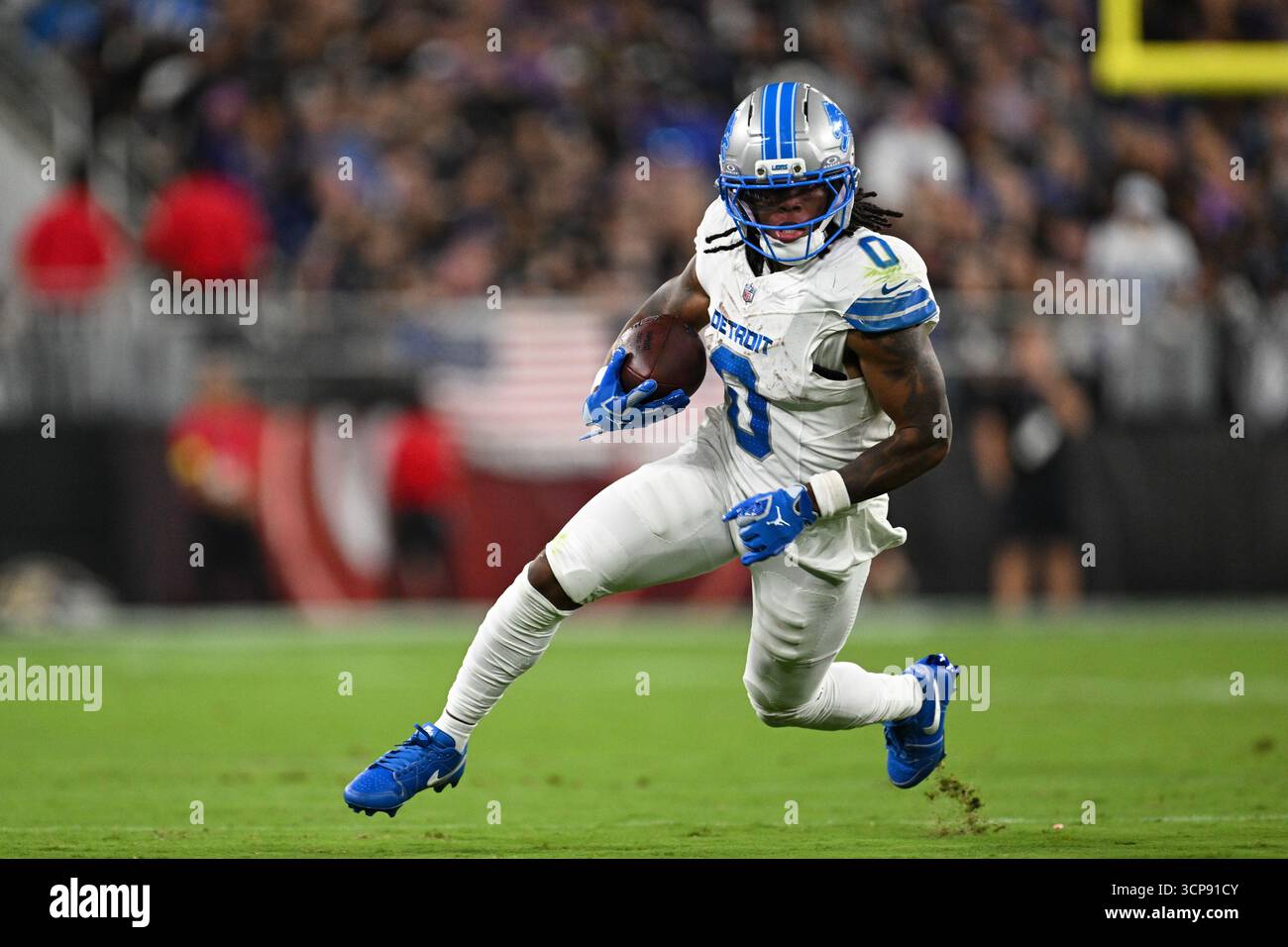 Detroit Lions running back Jahmyr Gibbs (0) runs with the ball after ...