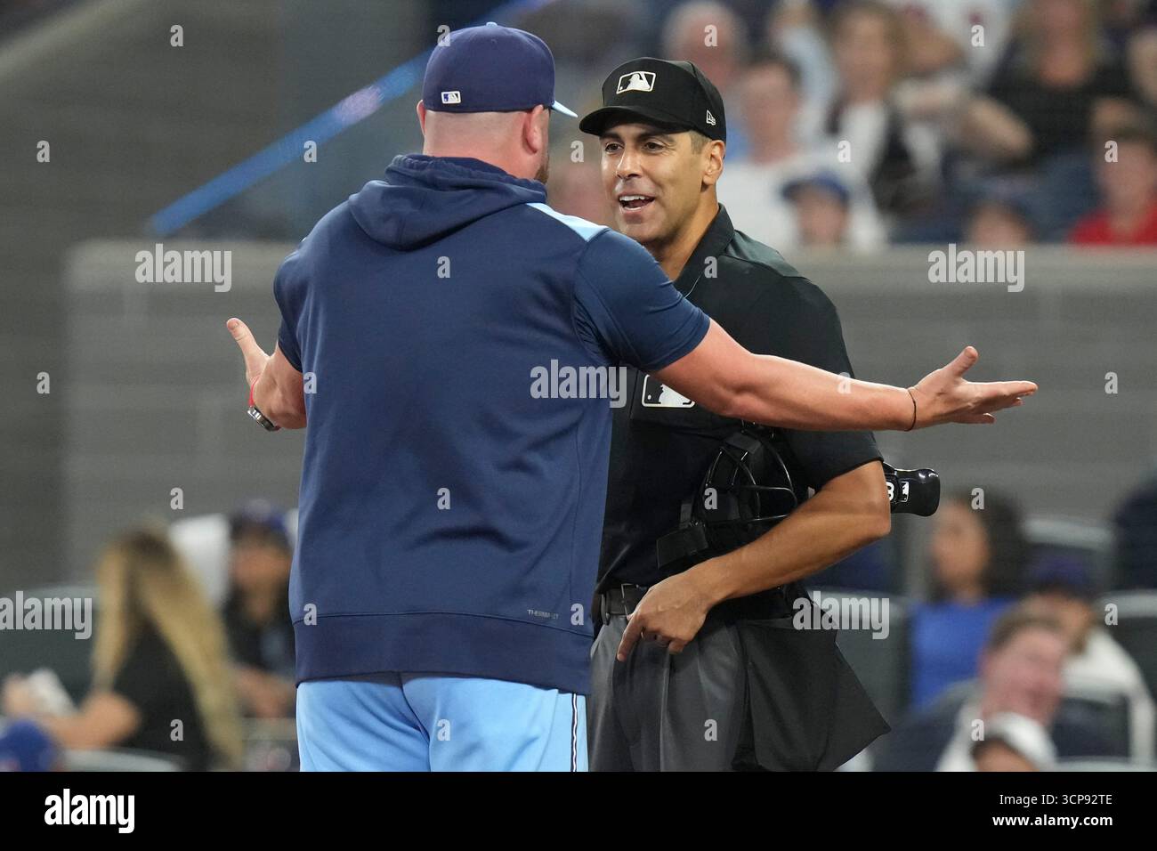 Home Plate Umpire Gabe Morales speaks to Toronto Blue Jays manager John ...