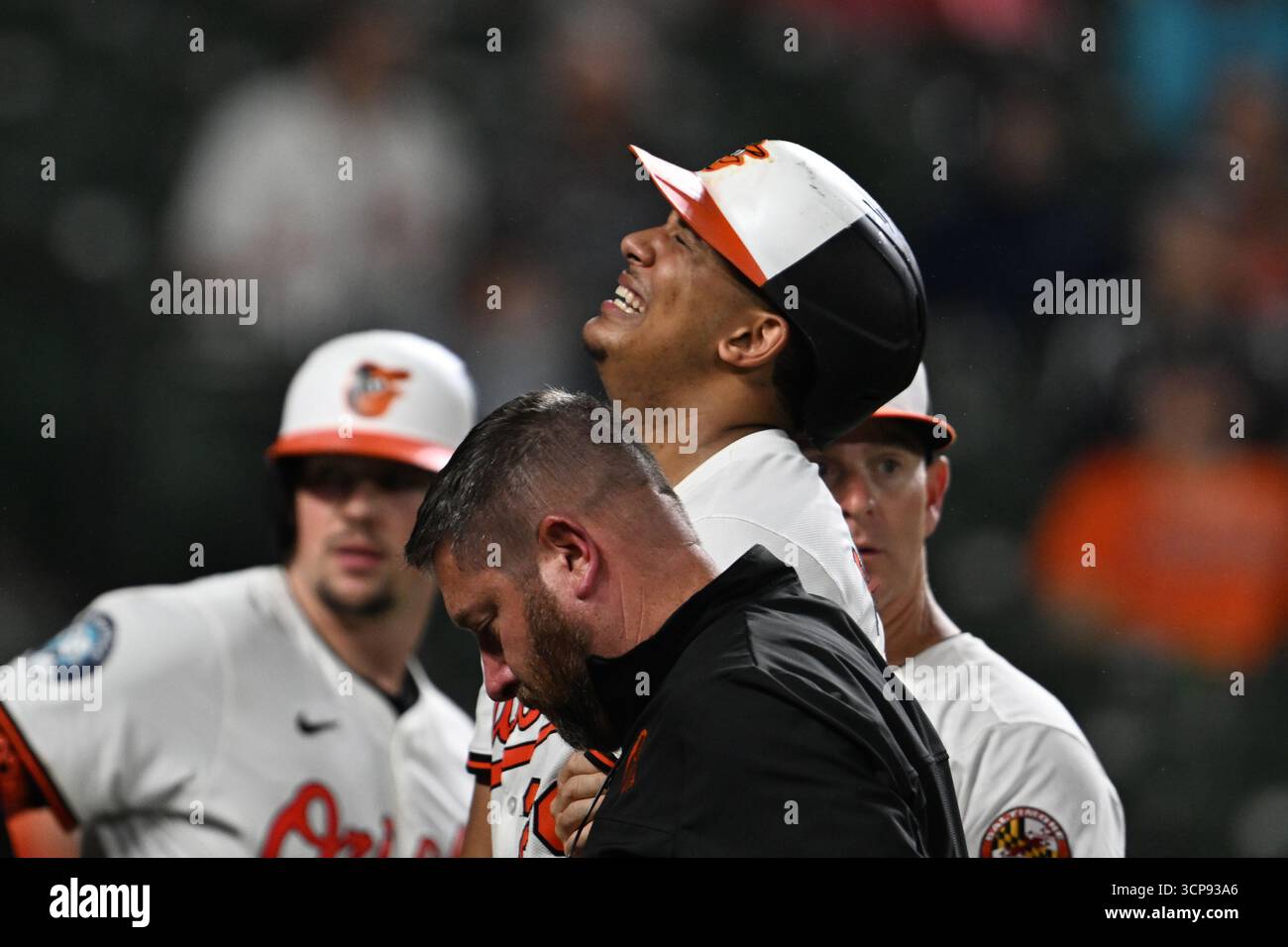 Baltimore Orioles' Samuel Basallo reacts after being hit by a pitch by ...