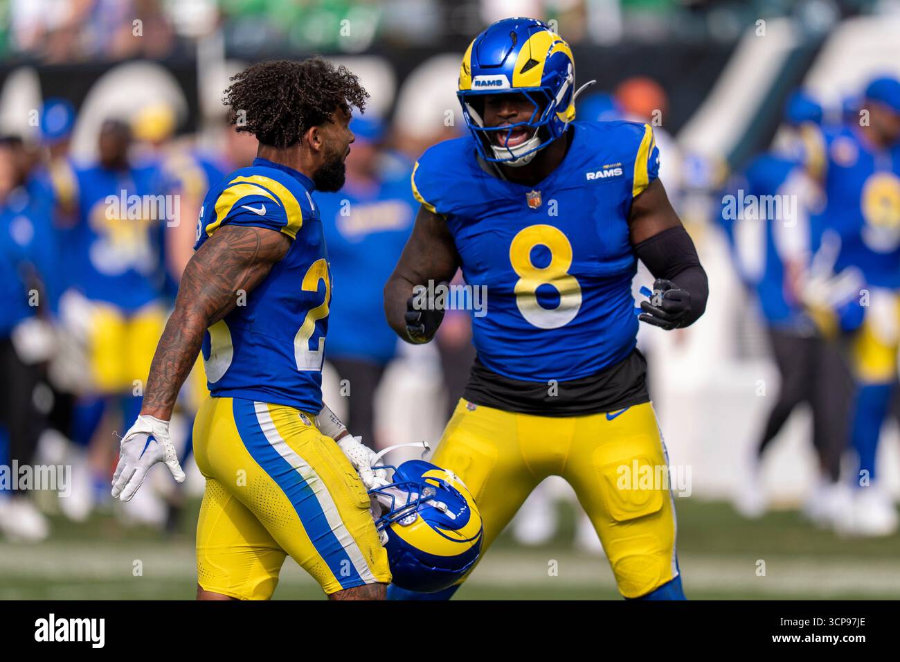 Los Angeles Rams linebacker Jared Verse, right, reacts with running ...