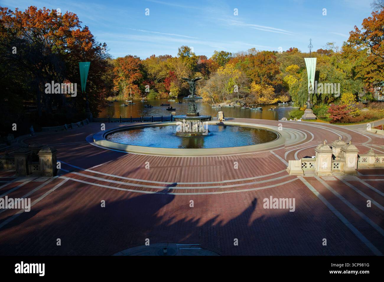 The Bethesda fountain, rowboats and the lush foliage and autumn leaves ...