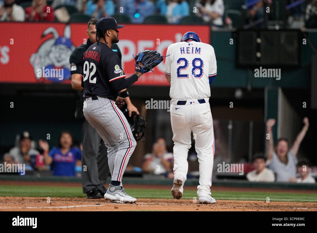 Texas Rangers' Jonah Heim (28) scores on a wild pitch by Minnesota ...