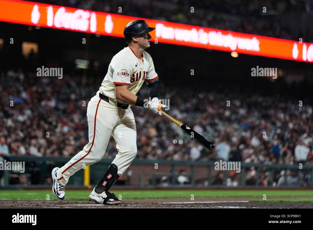 San Francisco Giants' Andrew Knizner watches his sacrifice fly during ...
