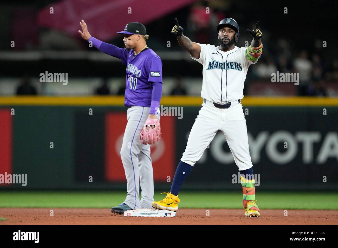 Seattle Mariners' Randy Arozarena, right, celebrates near Colorado ...
