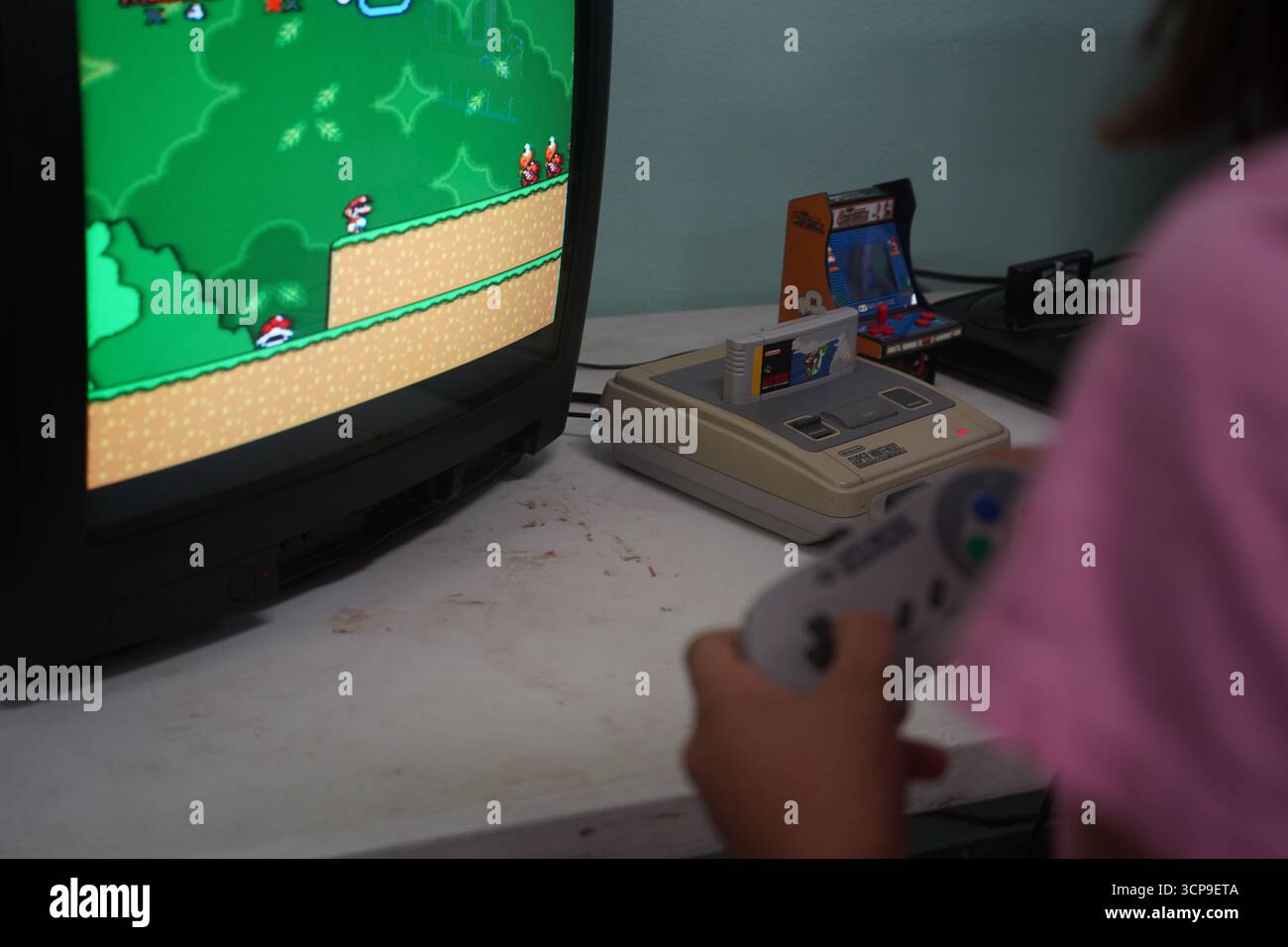 A nostalgic image of a vintage Super Nintendo (SNES) and controller on ...