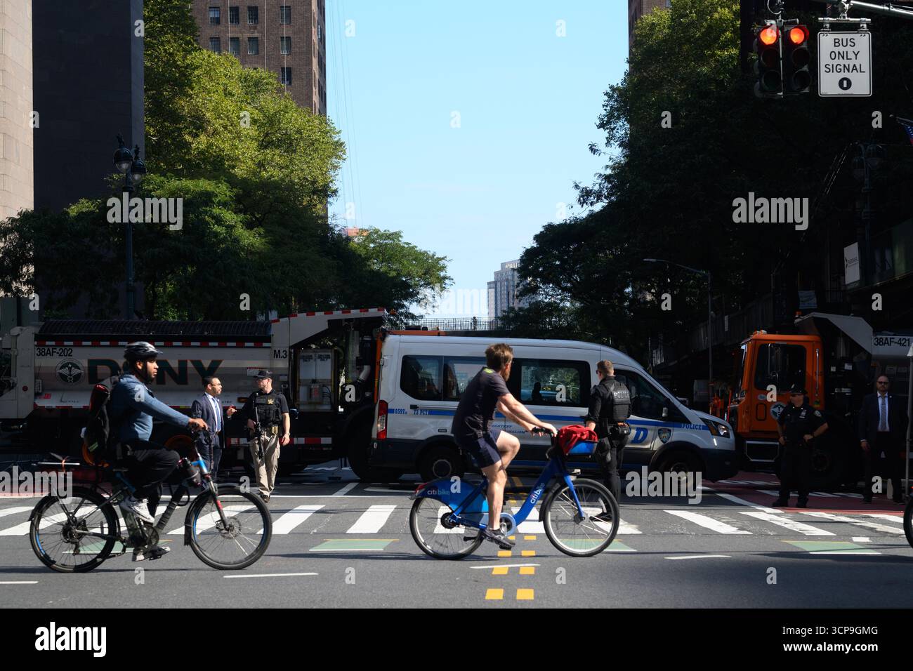 Bicyclists in Midtown Manhattan pass heavy security on the first day of ...