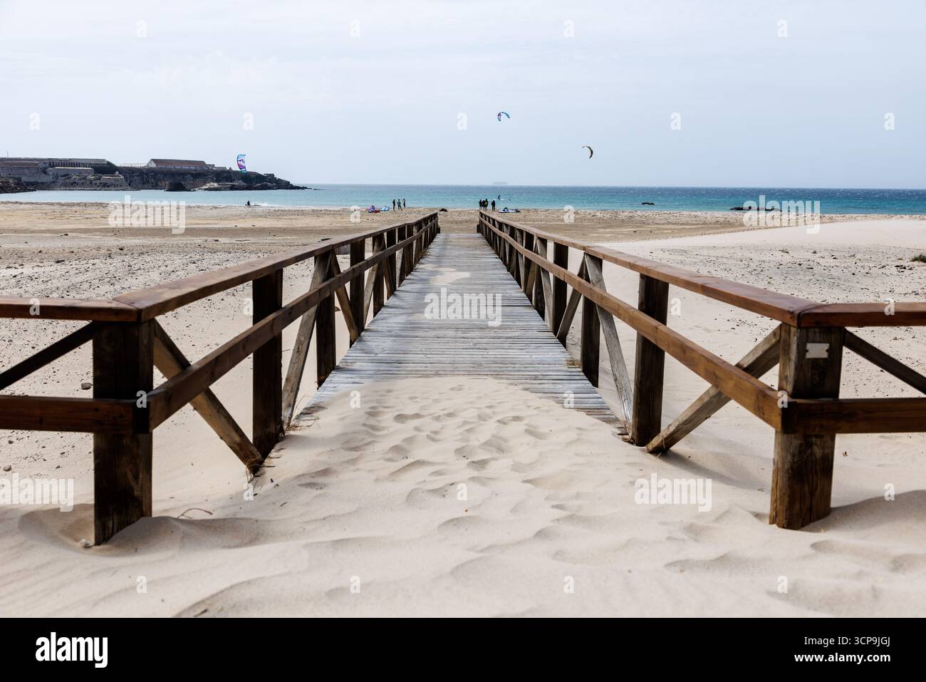 18 September 2025, Spain, Tarifa: A wooden walkway with wooden railings ...