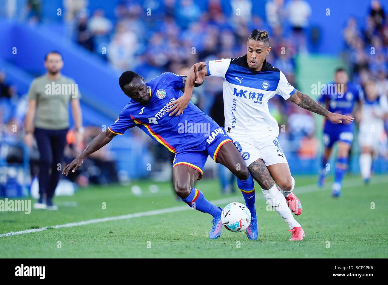Dakonam Djene of Getafe CF and Mariano Diaz of Deportivo Alaves during ...