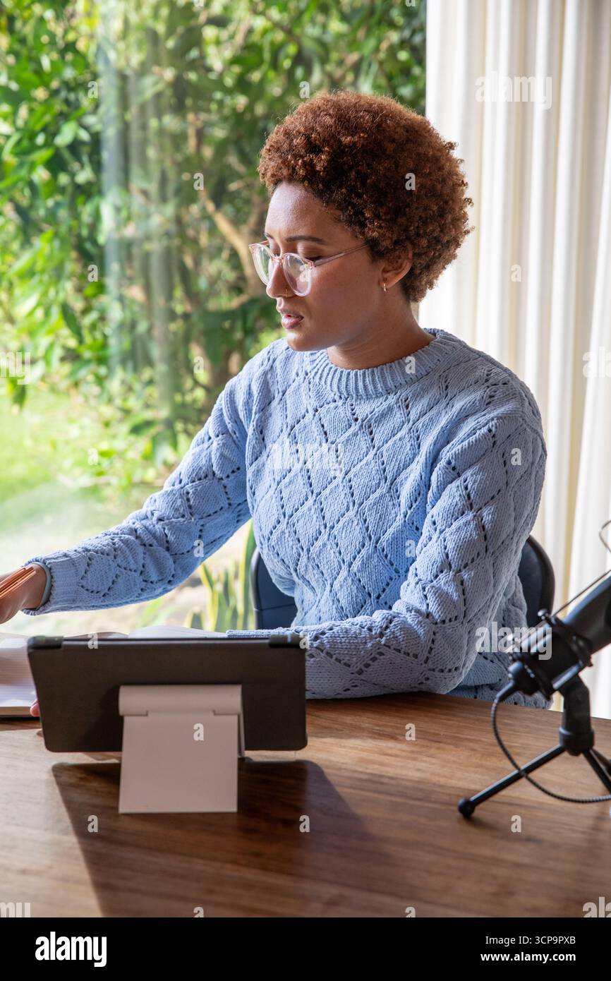 African woman content creator writing hi-res stock photography and ...