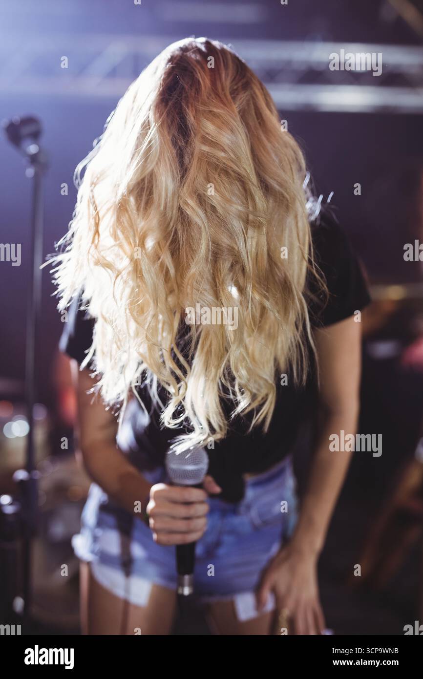 Female singer leaning on hi-res stock photography and images - Alamy