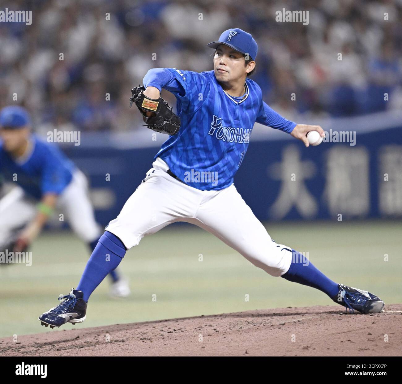 DeNA BayStars left-hander Katsuki Azuma pitches en route to picking up ...