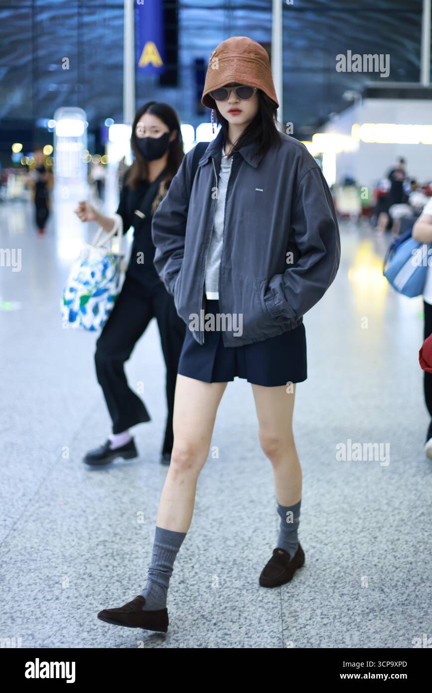 Chinese actress and singer Guan Xiaotong appears at the airport in ...