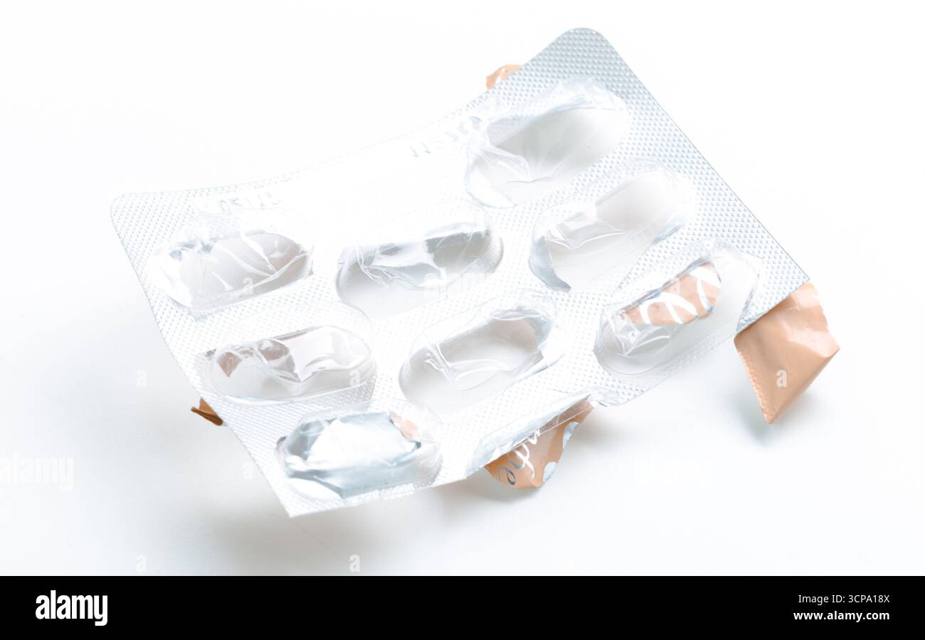 Empty blister pack of medication lying on a clean white surface Stock ...