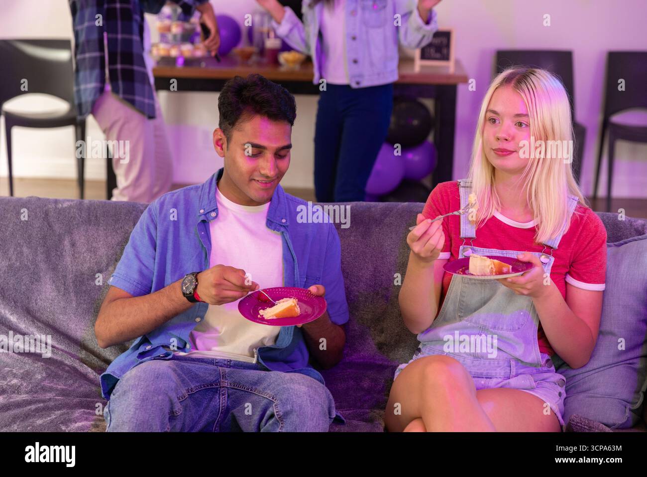 Diverse friends eating cake hi-res stock photography and images - Alamy