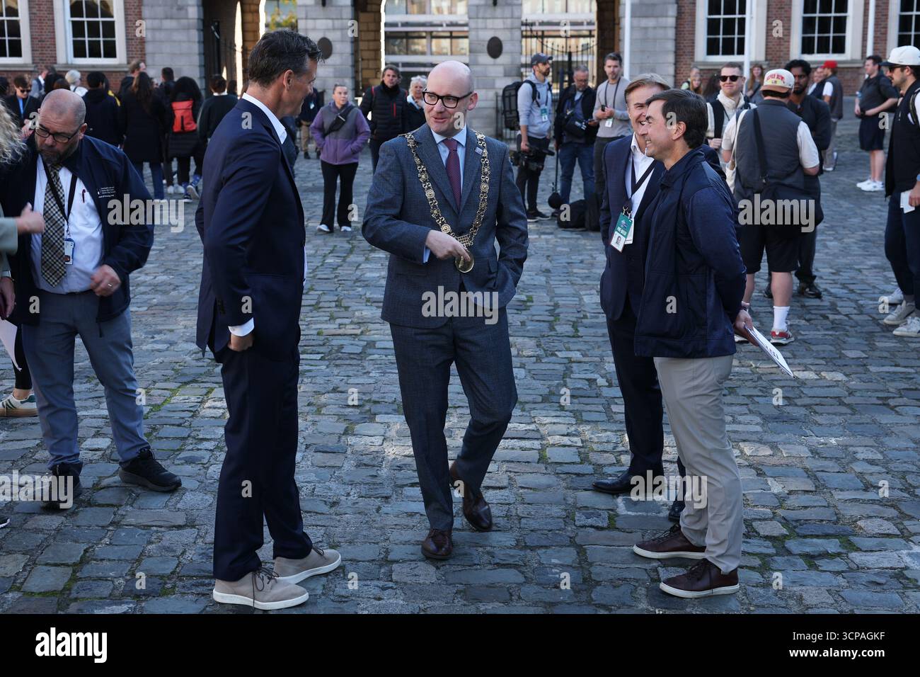Ray McAdam, Lord Mayor of Dublin, center, speaks with Henry Hodgson ...