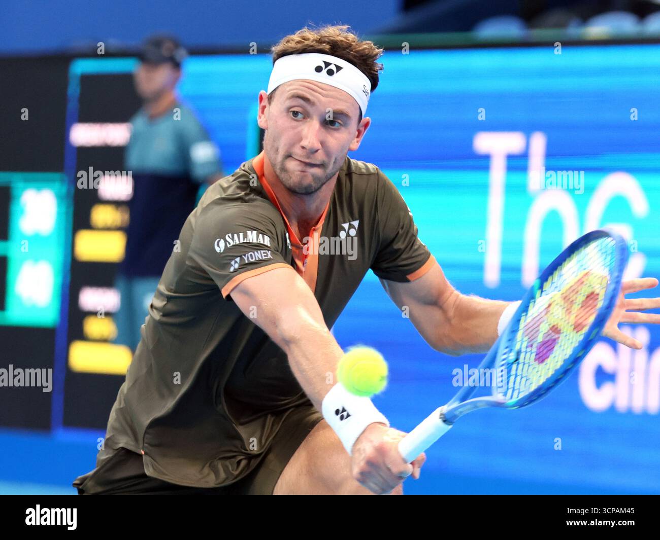 September 25, 2025, Tokyo, Japan - Casper Ruud of Norway returns the ...