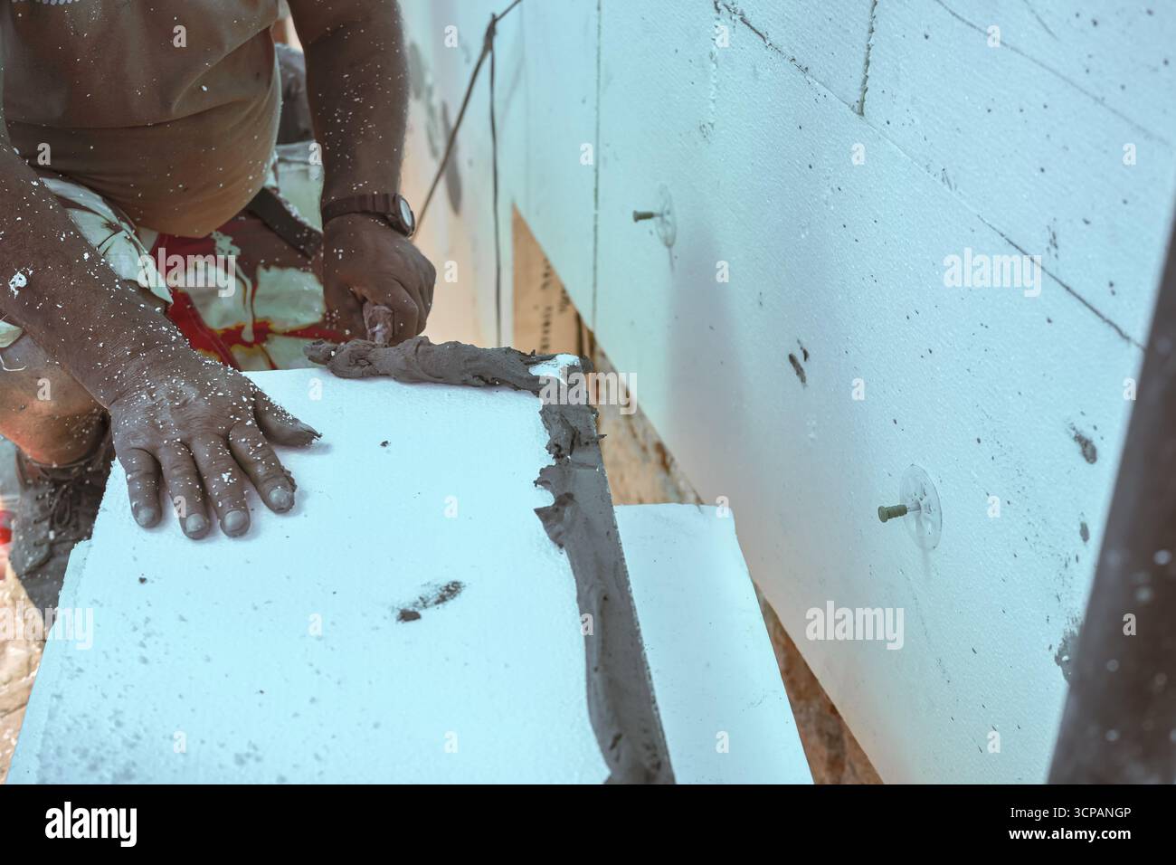 Worker putting glue mix on hi-res stock photography and images - Alamy