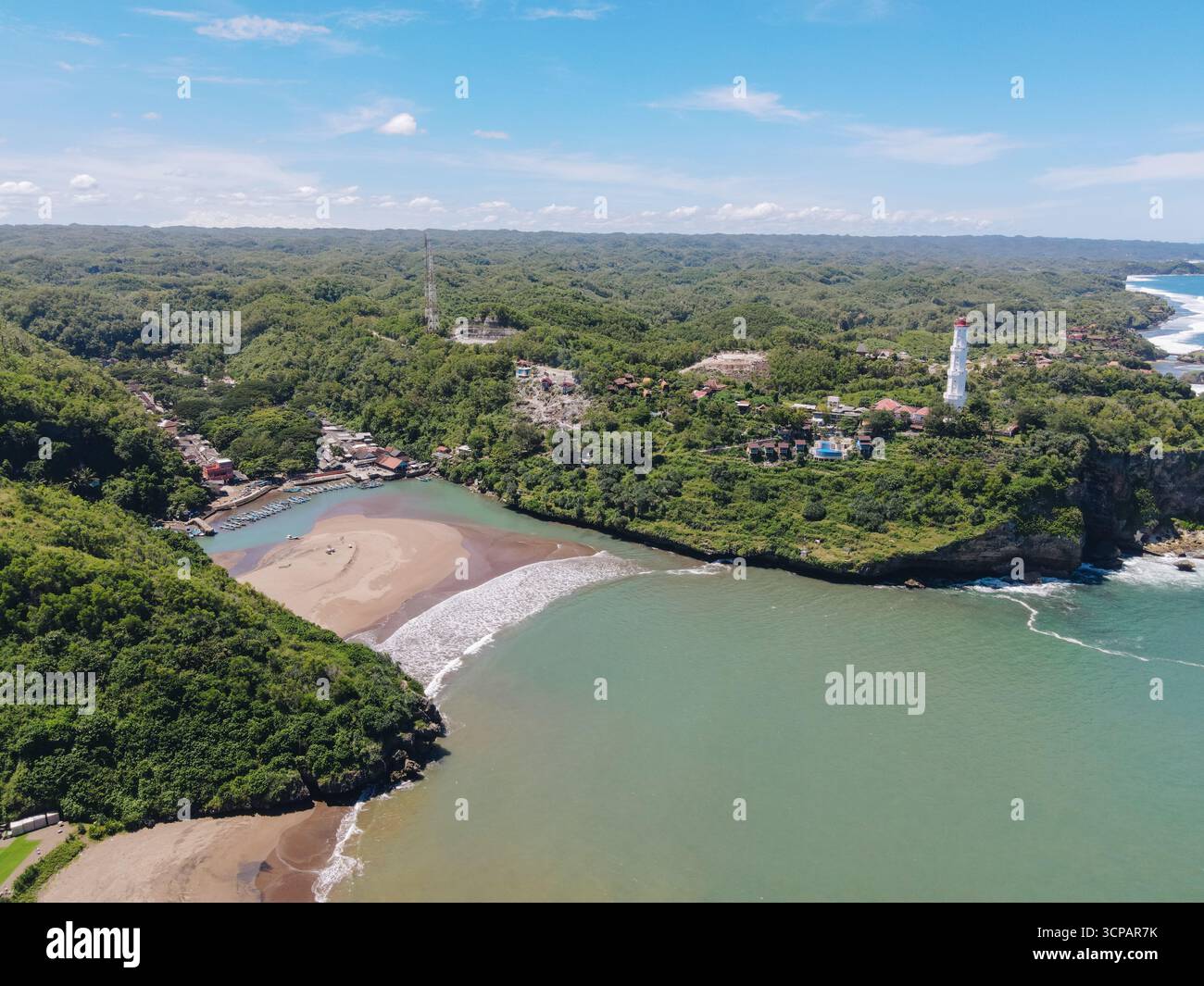 Aerial view of the iconic lighthouse stands guard over the coastline ...