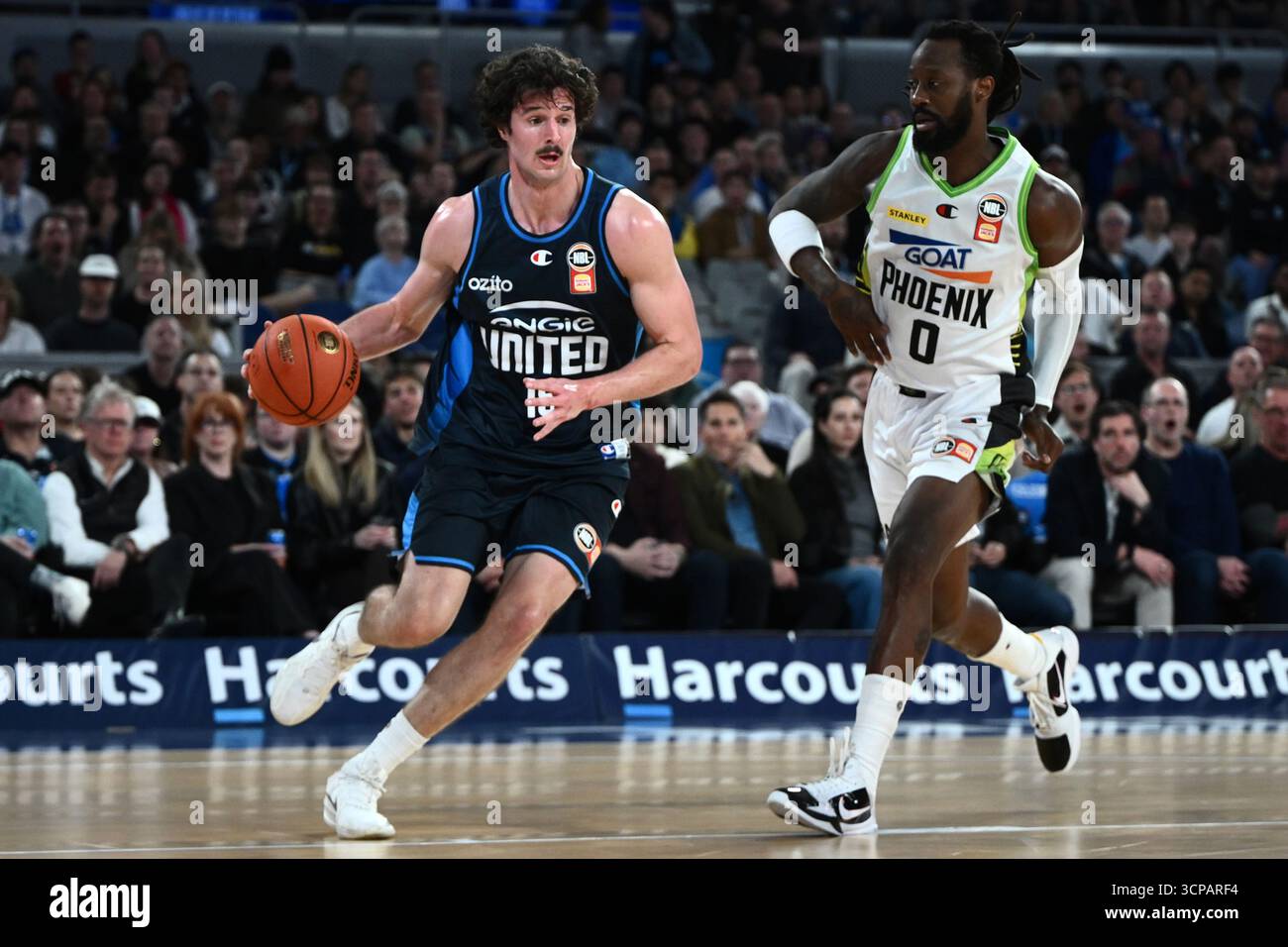 Kyle Bowen of Melbourne United (left) and John Brown III of the Phoenix ...