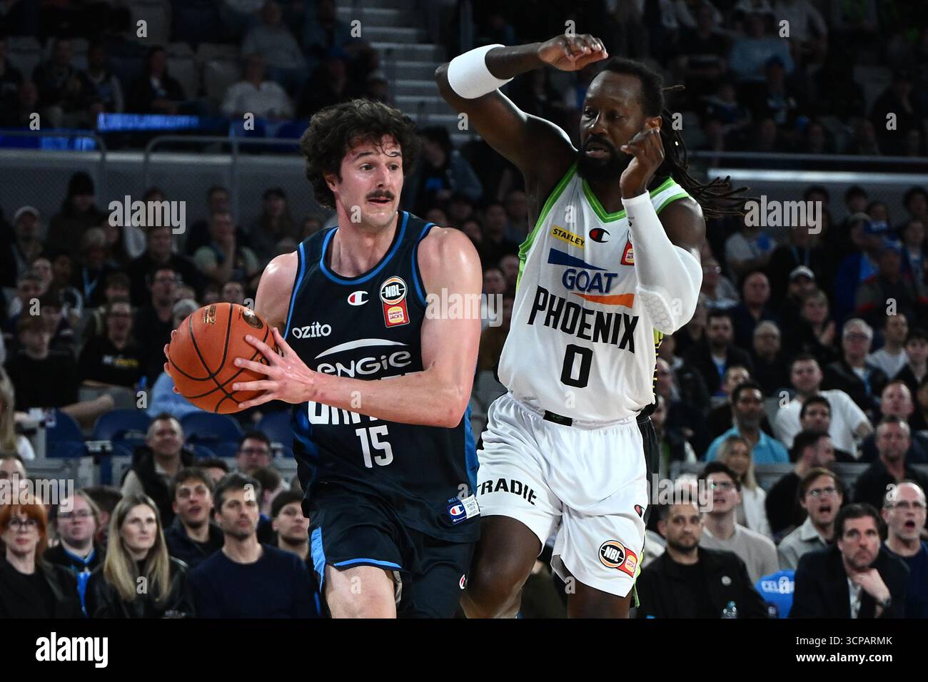 Kyle Bowen of Melbourne United (left) and John Brown III of the Phoenix ...