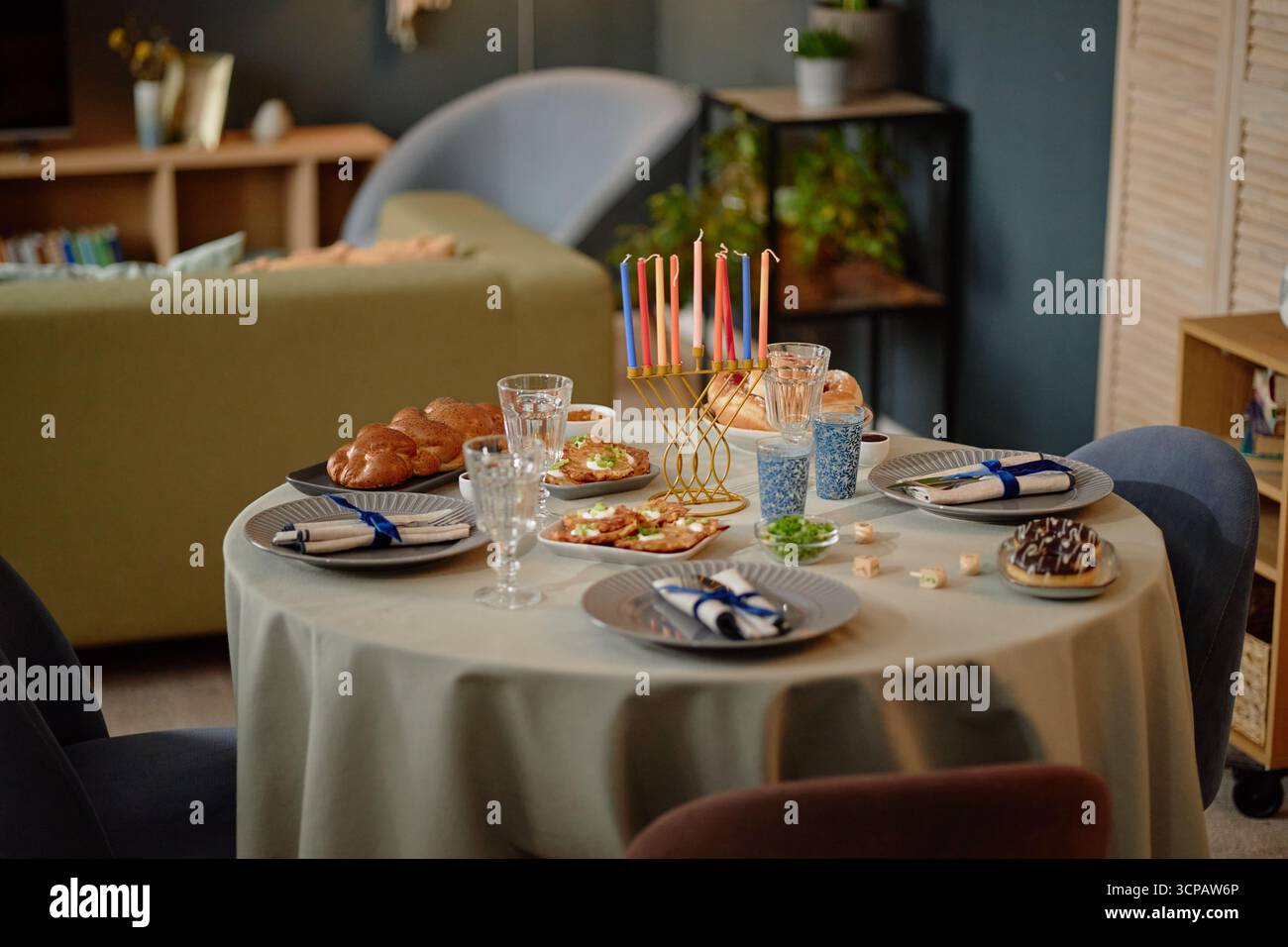 Hanukkah Table Setting Featuring Menorah and Traditional Holiday Foods ...