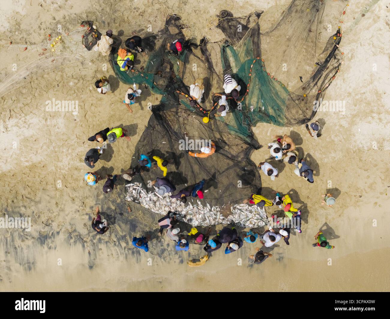Aerial view fishermen hauling nets hi-res stock photography and images ...