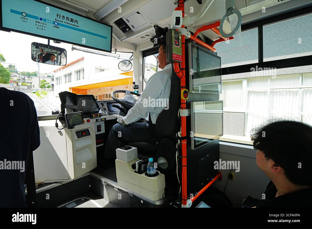 An autonomous driving bus is in operation with passengers on board as a ...