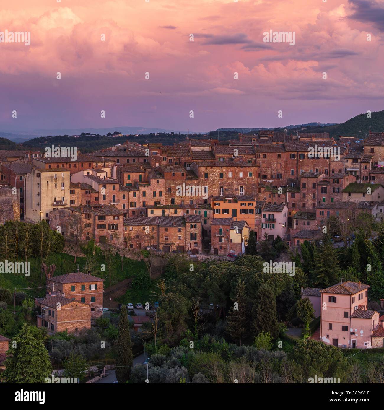 Aerial view of ancient buildings cascading down the hillside under a ...
