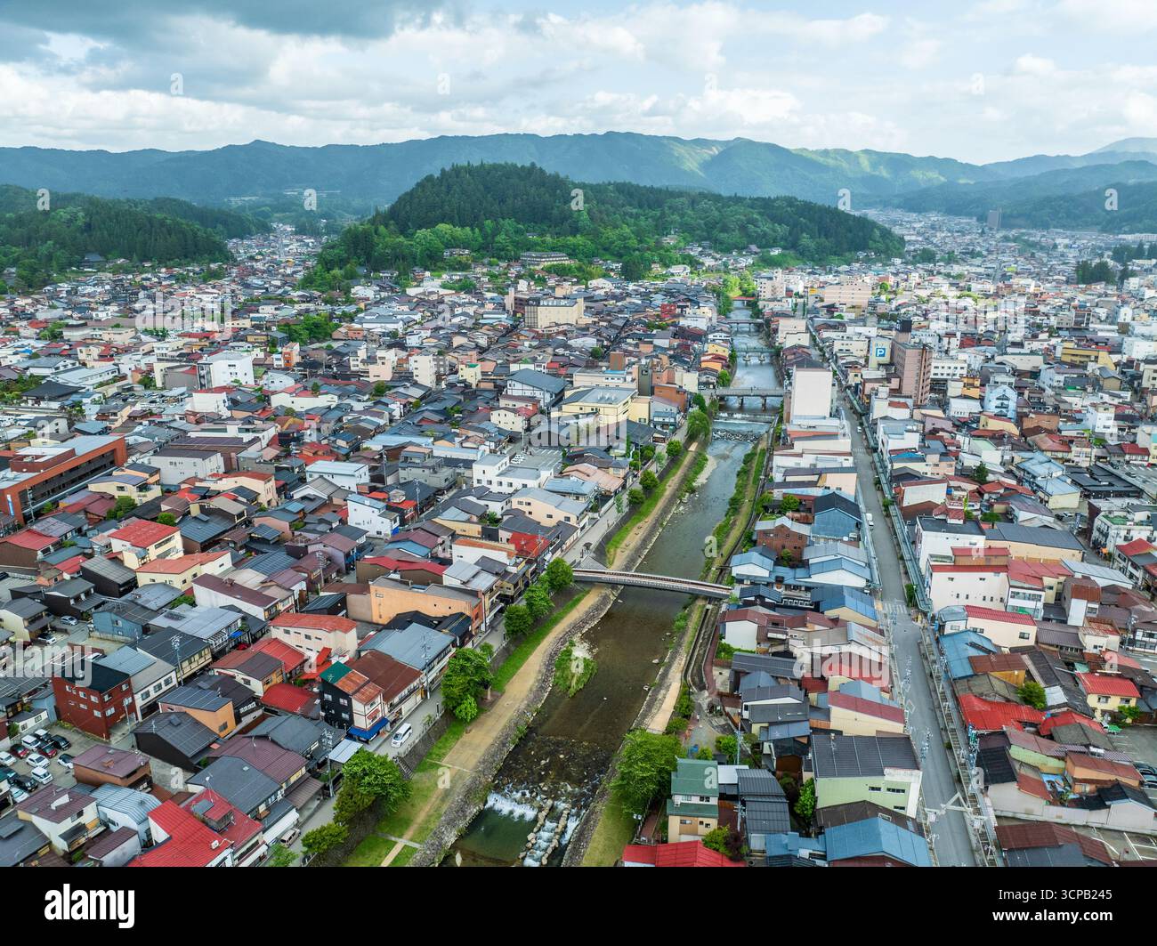 Aerial view of a vibrant town bisected by a tranquil river, where ...