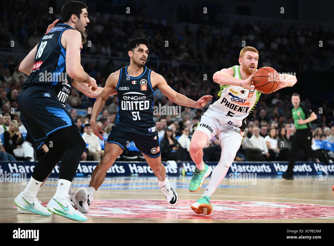 Shea Ili of Melbourne United (left) and Angus Glover of the Phoenix ...