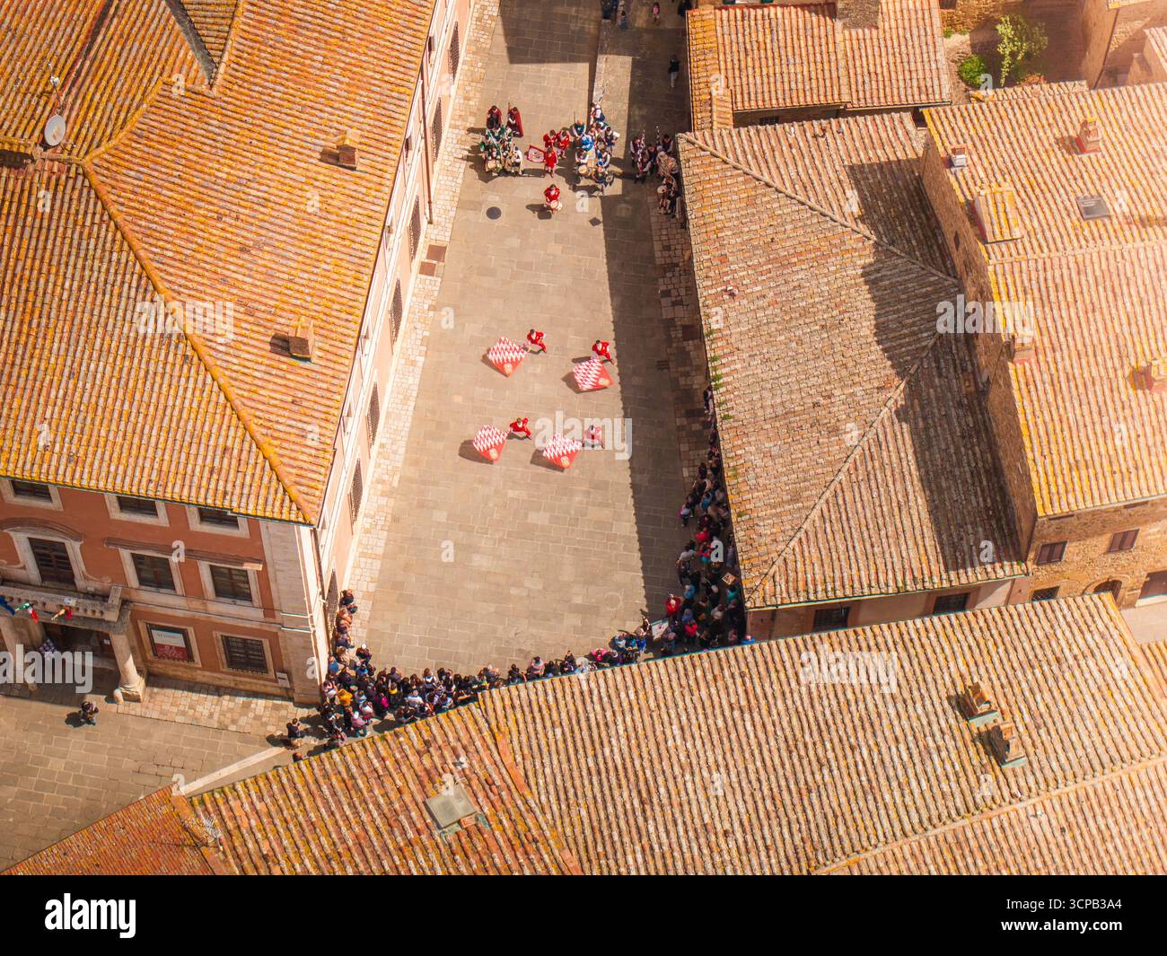 Aerial view of sun-kissed terracotta roofs casting shadows over the ...
