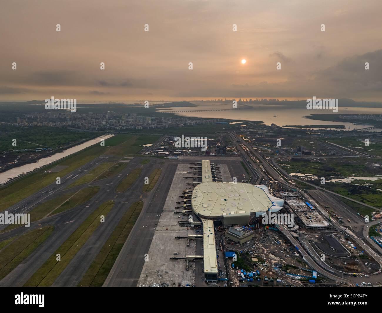 Aerial view of the Navi Mumbai International Airport glimmers under the ...