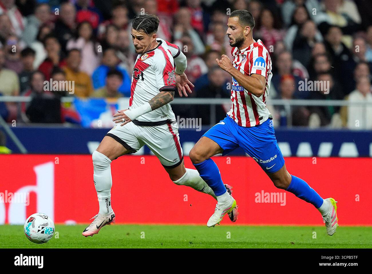 Atletico de Madrid's David Hancko (r) and Rayo Vallecano's Andrei Ratiu ...