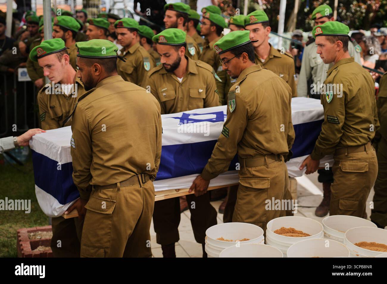 Israeli soldiers carry the flag-draped casket of Staff Sgt. Chalachew ...