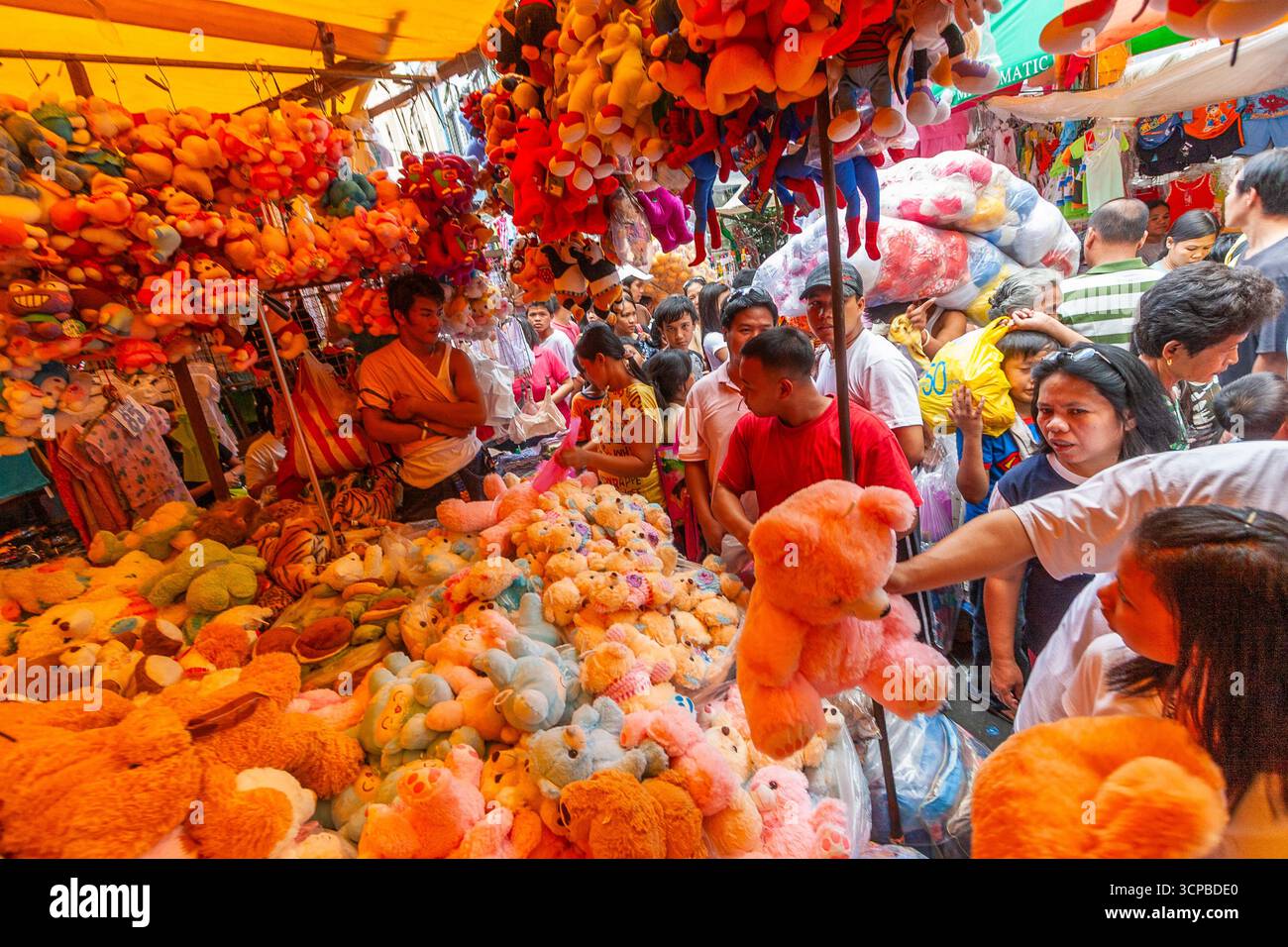 A busy and crowded street market scene during the Christmas holiday ...