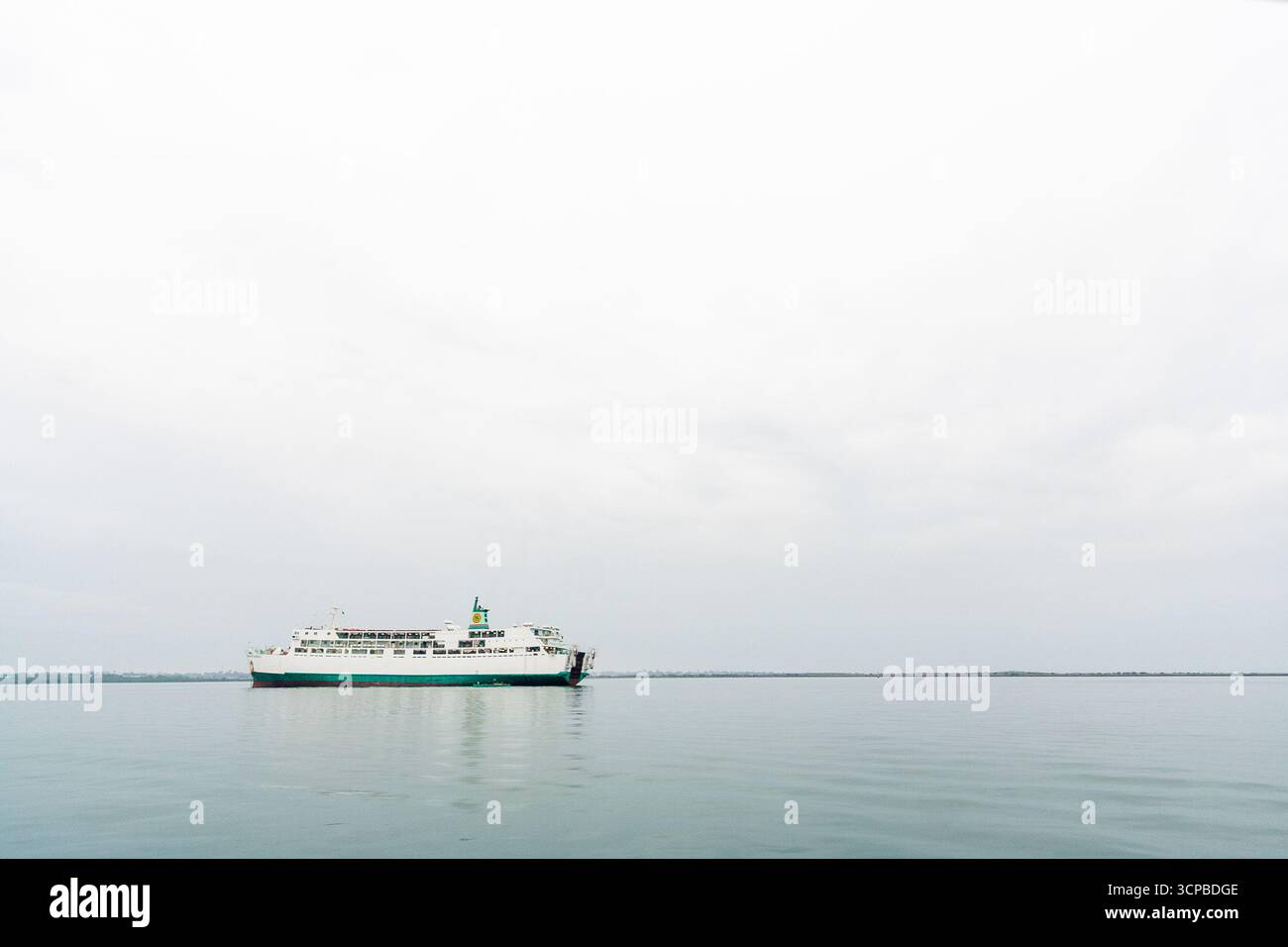 A commercial passenger boat, an interisland vessel, anchored at sea off ...