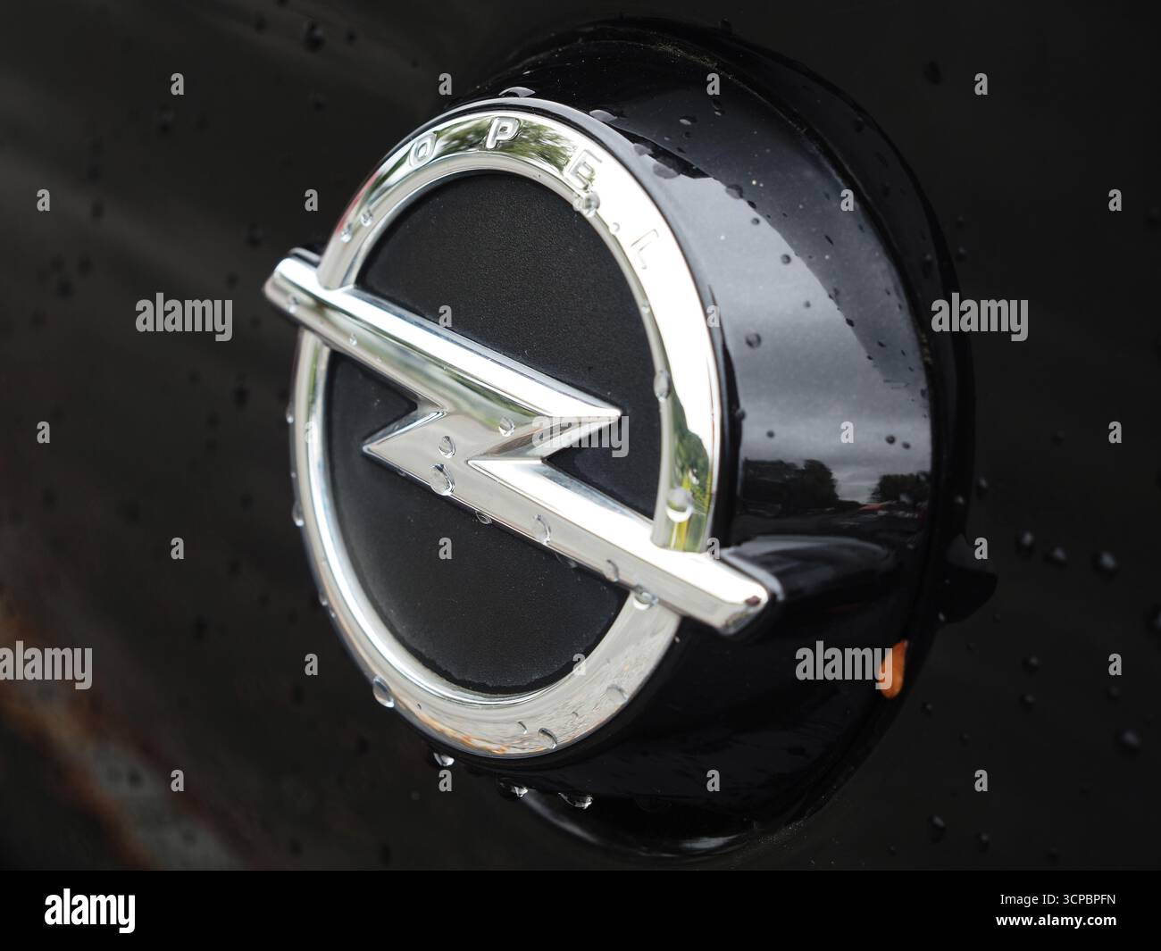 A striking shot of the circular Opel logo with its iconic lightning ...