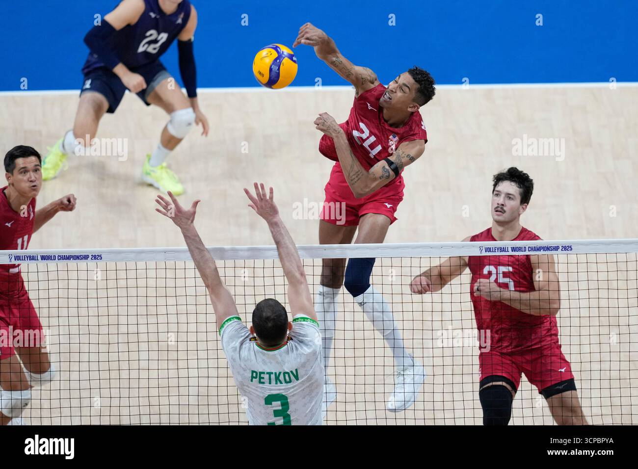 Merrick McHenry of the United States spikes against Iliya Petkov of ...