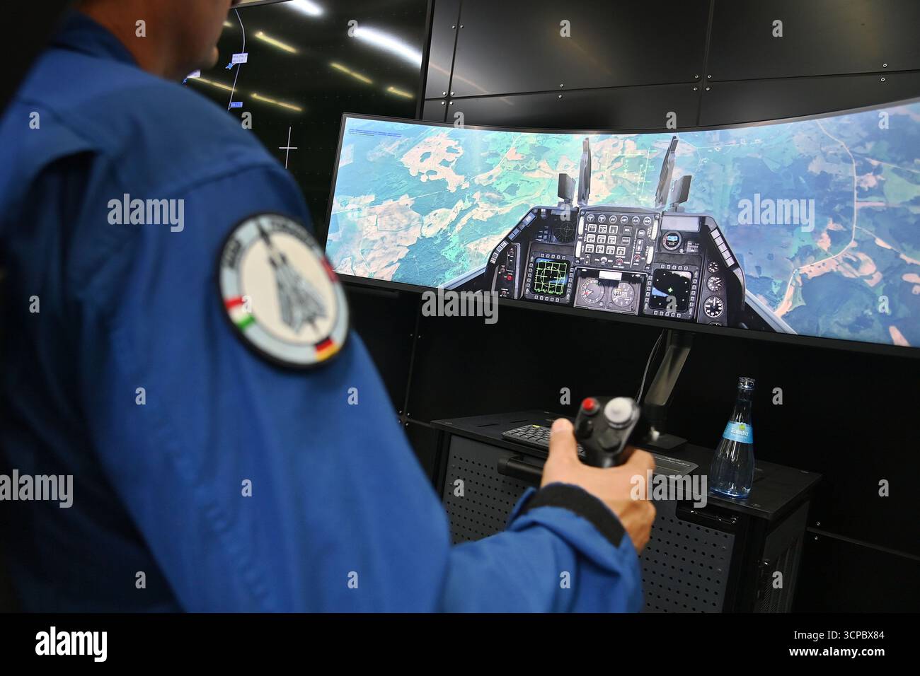 An unmanned drone is flown and controlled by a pilot, aiming at its ...