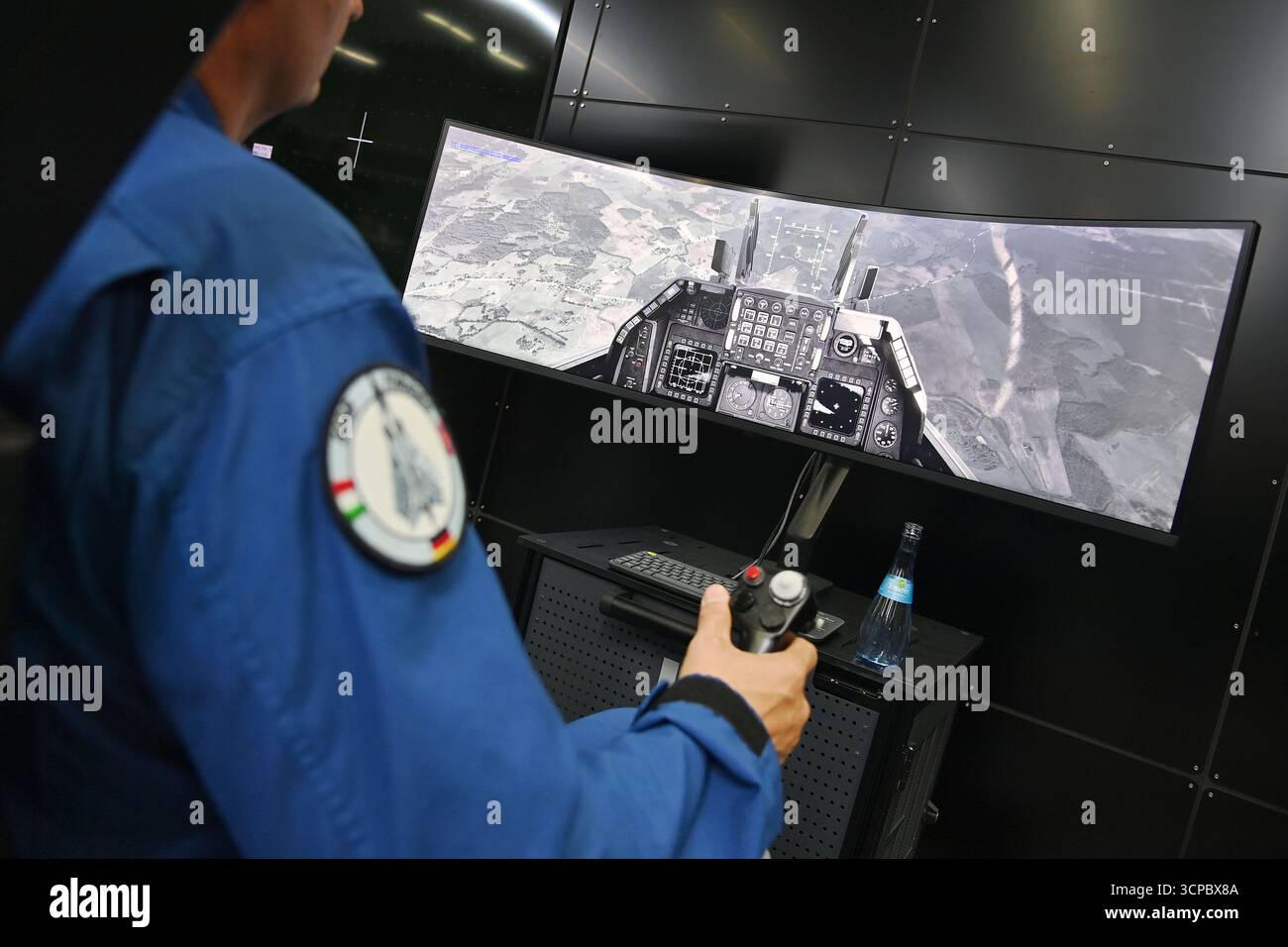 An unmanned drone is flown and controlled by a pilot, aiming at its ...