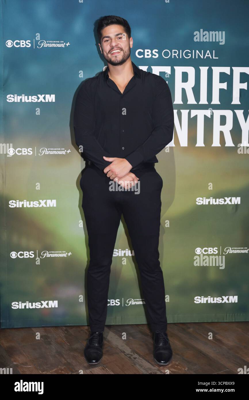 Sam Phelan of the Survivor 47 series cast poses for the media during ...