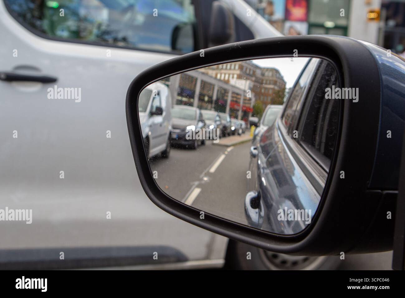 Car Mirror showing a line of traffic Stock Photo - Alamy