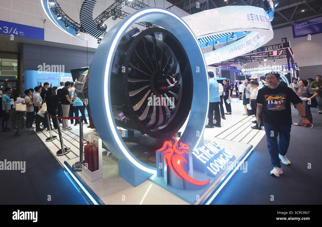 HANGZHOU, CHINA - SEPTEMBER 25, 2025 - Viewers watch large aviation ...